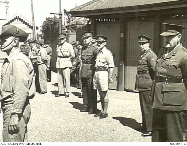 Senior Army officers stand on the platform of the Showgrounds Station ...