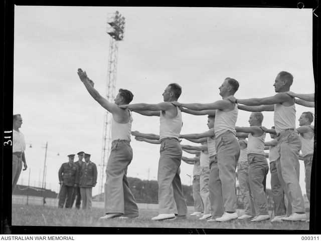 SHOWGROUNDS - MASS DRILL - FEET ASTRIDE JUMP. ARMY. MEN OF THE 1ST ARMY ...