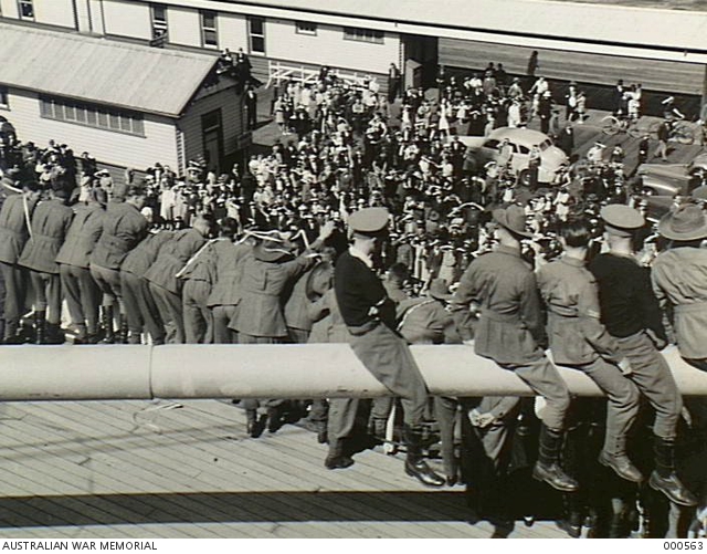 BOYS WAVE GOODBYE TO FRIENDS ON THE WHARF PRIOR TO DEPARTURE. ARMY ...
