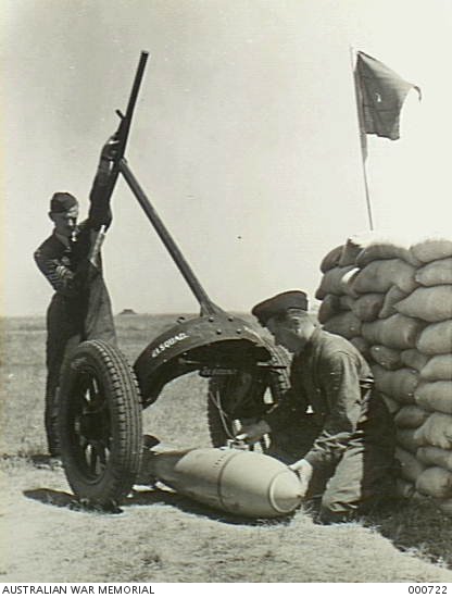 LAVERTON - ARMOURERS LOADING 500 LB BOMBS WITH BOMB TROLLEY. RAAF ...
