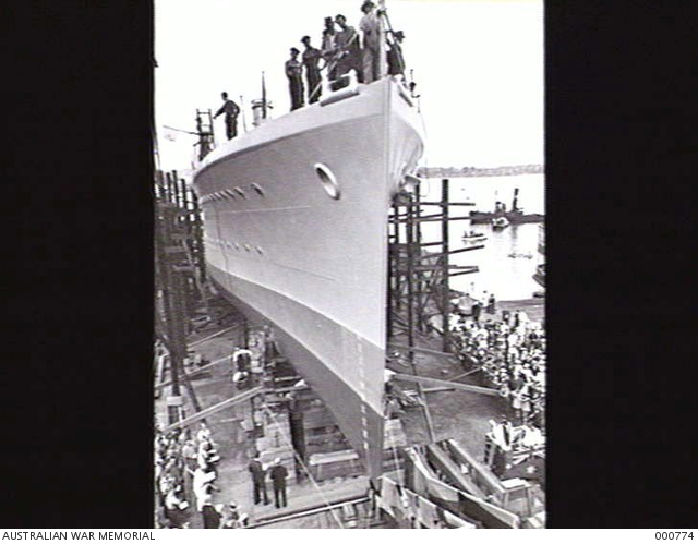 THE RAN SLOOP HMAS WARREGO RECEIVING A BLESSING DURING THE LAUNCHING ...