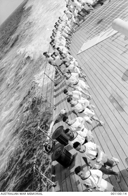 Crew members of the modified Leander Class cruiser HMAS Hobart engaged ...