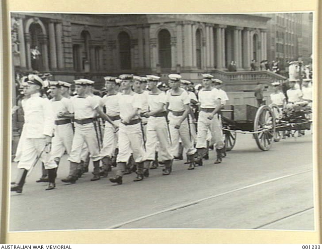 SYDNEY. H.M.A.S. PERTH. GUN TEAM PASSING TOWN HALL DURING MARCH ...