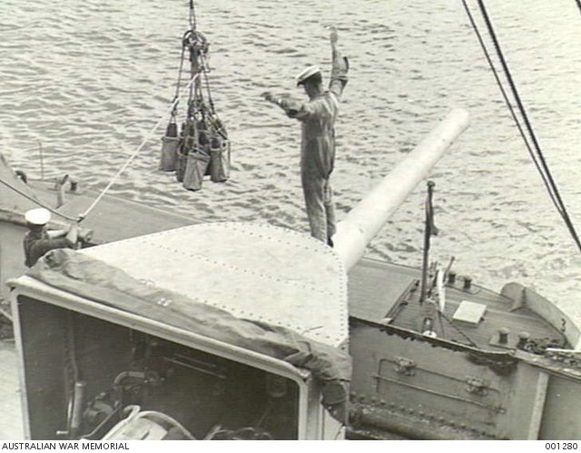 Shells being swung abord the Armed Merchant Cruiser HMAS Westralia for ...