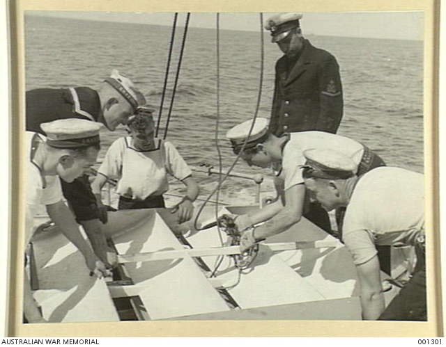 MINE SWEEPING. PREPARING THE "KITE" FOR PUTTING OVERBOARD. THE KITE IS ...