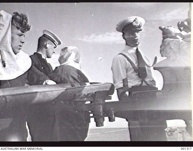 GUNNERY PRACTICE ABOARD THE AUXILIARY MINESWEEPER, HMAS DOOMBA. AN RAN ...
