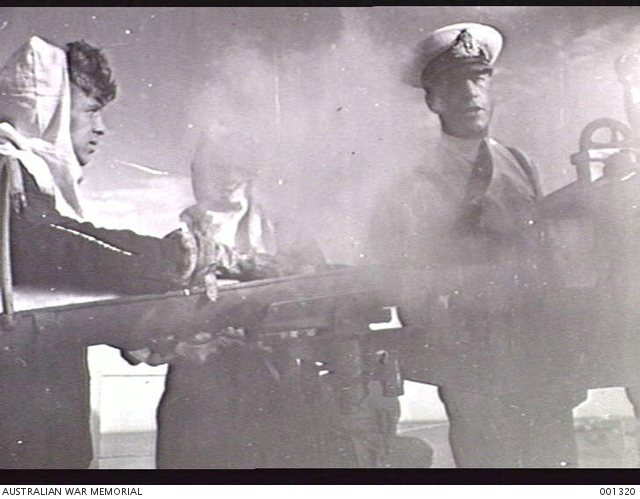 GUNNERY PRACTICE ABOARD THE AUXILIARY MINESWEEPER HMAS DOOMBA. TWO RAN ...