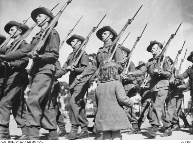 6TH DIVISION AIF TROOPS MARCH PAST AT PUCKAPUNYAL REVIEW. A LITTLE GIRL ...