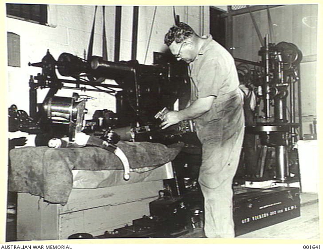 A workman repairing a Vickers .303 inch machine gun at a RAN ...