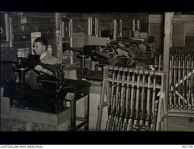 Munitions employees at the Small Arms Factory, testing the rifles that ...