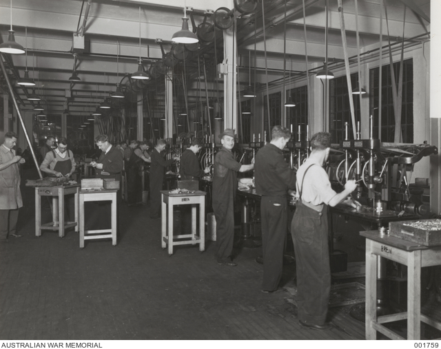 Munitions employees at the Small Arms Factory making Bren guns. The ...