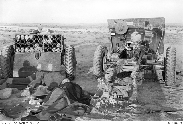 A 4.5 inch Howitzer (right) with breech block open and its supporting ...