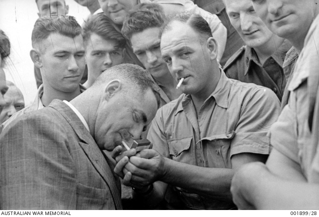 One of this group of soldiers of the 6th Division provided a light for ...