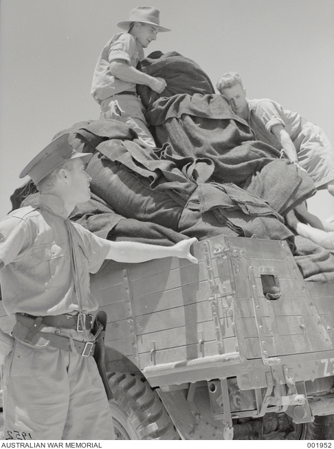 LOADING UP BLANKETS FOR NEW ARRIVALS OF 17TH BRIGADE AT BIET JERJIA ...