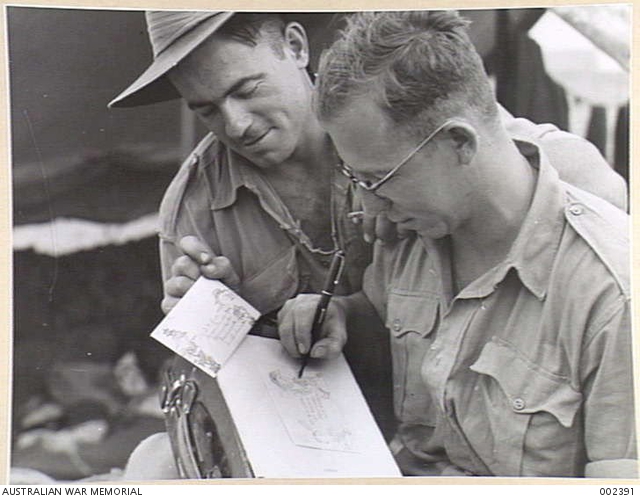 BEIT JERJIA. PTE. A. LEES LOOKS ON AS PTE. A. WEIR DECORATES HIS ...
