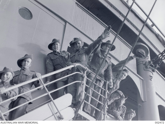 Troops of units of the Second AIF waving farewell after embarking on a ...