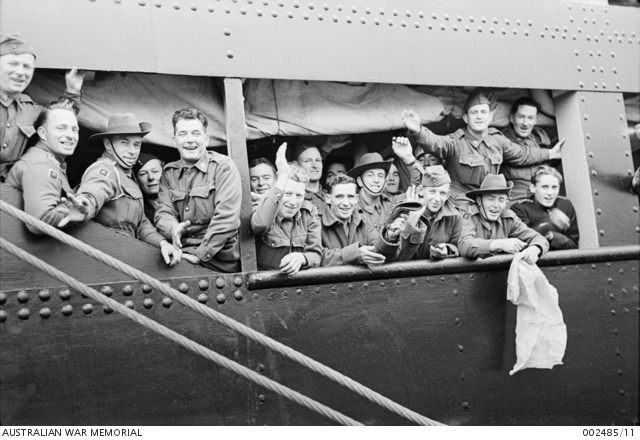 Troops of units of the 6th Division gather at the rails on one of the ...