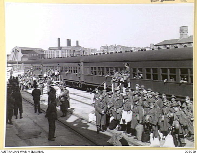 A group of Australian troops who have just detrained and waiting to ...
