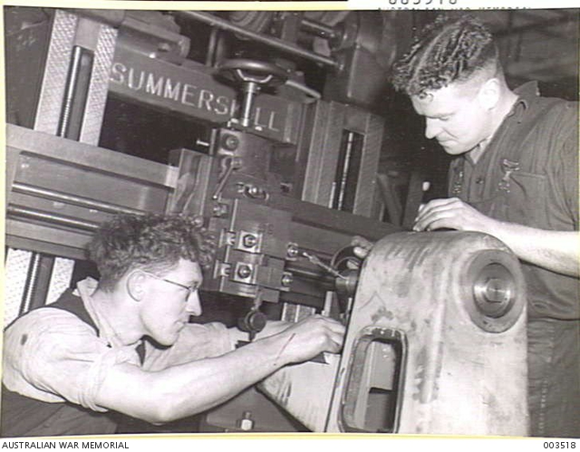 Two technicians at South Melbourne Technical School planing a lathe ...