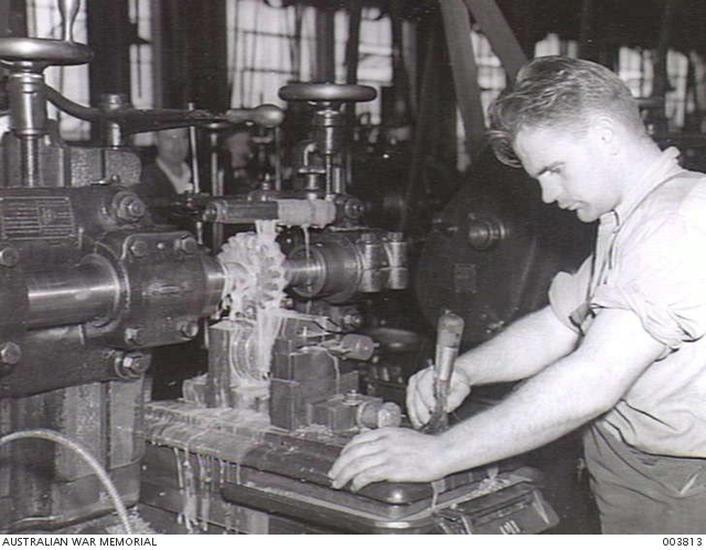 A workman at the Small Arms Factory, in the process of gash milling a ...