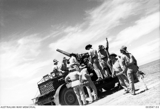 After all gauges and dials on the gun are checked, the unidentified NCO ...