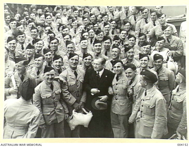 A member of the Returned Services League (RSL), in dark suit, with ...