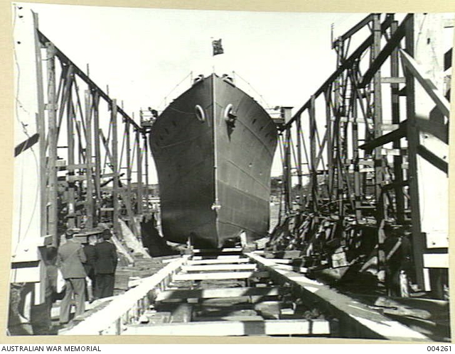 SYDNEY, NSW. WITH FLAG FLYING THE RAN CORVETTE HMAS LISMORE GLIDES ...