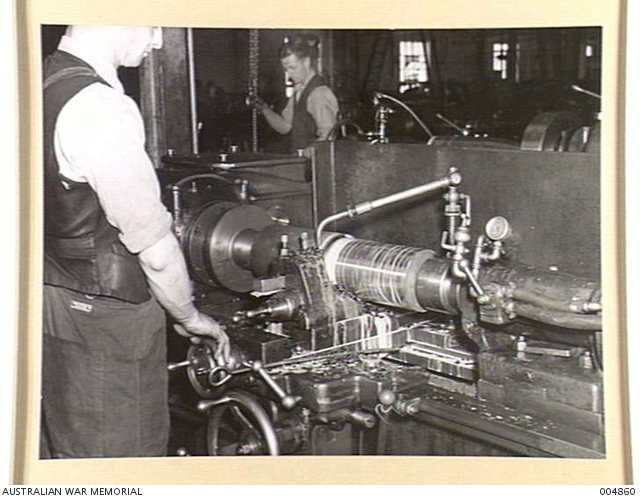 WORKING ON A SHELL. (NEGATIVE BY BOTTOMLEY). | Australian War Memorial
