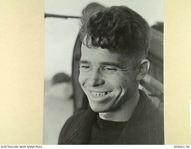 Off Bardia. A happy sailor aboard HMS Ladybird. | Australian War Memorial