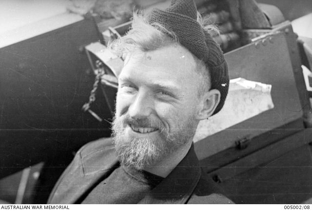 An unidentified happy sailor aboard HMS Ladybird relaxes during a ...