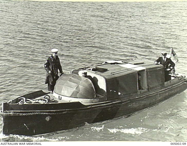Lieutenant Commander J. F. Blackburn returning to his ship HMS Ladybird ...