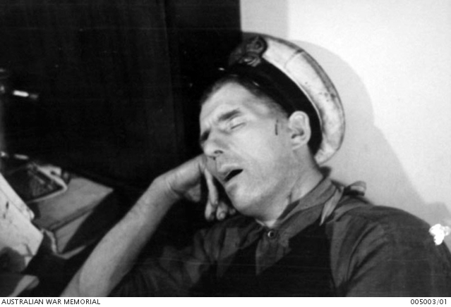 An unidentified member of the crew of HMS Ladybird snatches a few ...