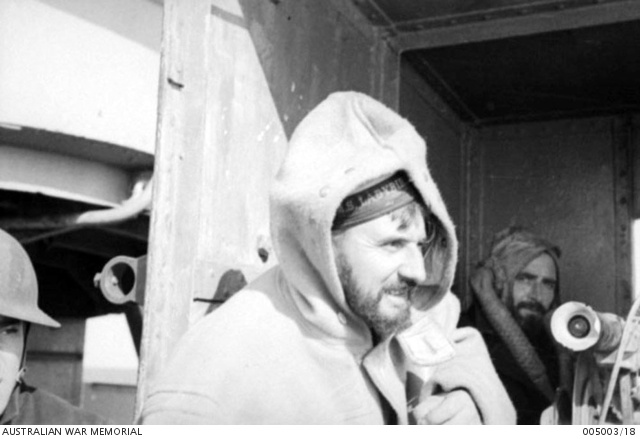 One of the crew of HMS Ladybird takes advantage of a respite in the ...