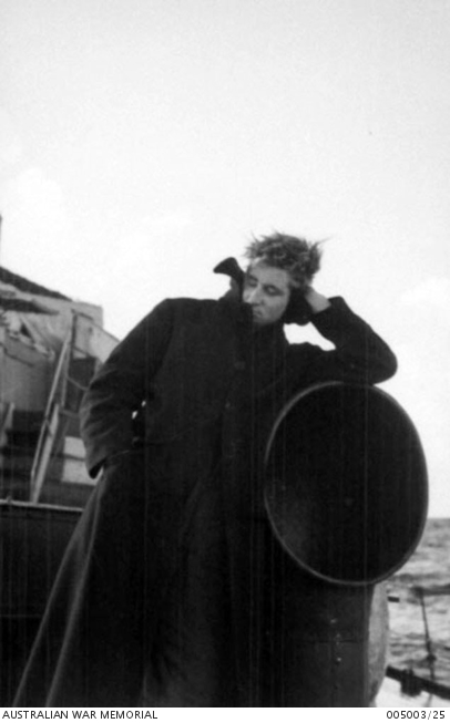 An unidentified rating aboard HMS Ladybird takes a nap standing up ...