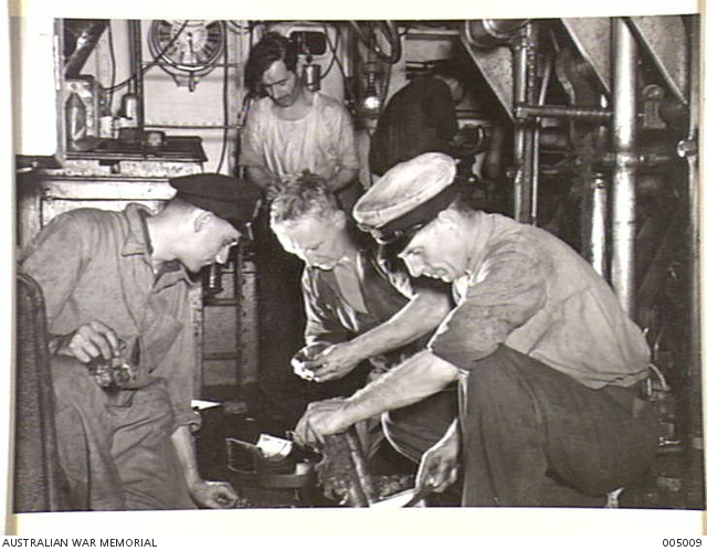 AT SEA OFF BARDIA. ENGINE ROOM ARTIFICERS DO A REPAIR JOB WHILE HMS ...