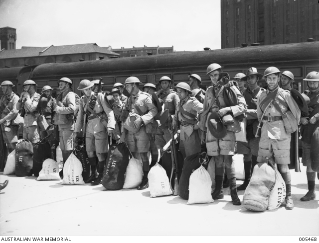 SIGNALLERS OF THE 8TH DIVISION SIGNAL UNIT AFTER DETRAINING WAITING TO ...
