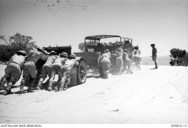 The Battery Commander (right) looks on as the members of an artillery ...