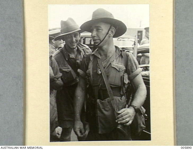 Troops of the 8th Division on the wharf after disembarking from the ...