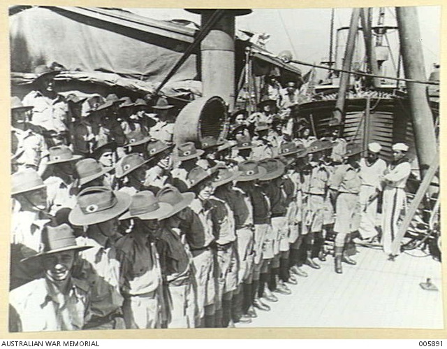 Australian troops of the 8th Division assembled on the deck of one of ...