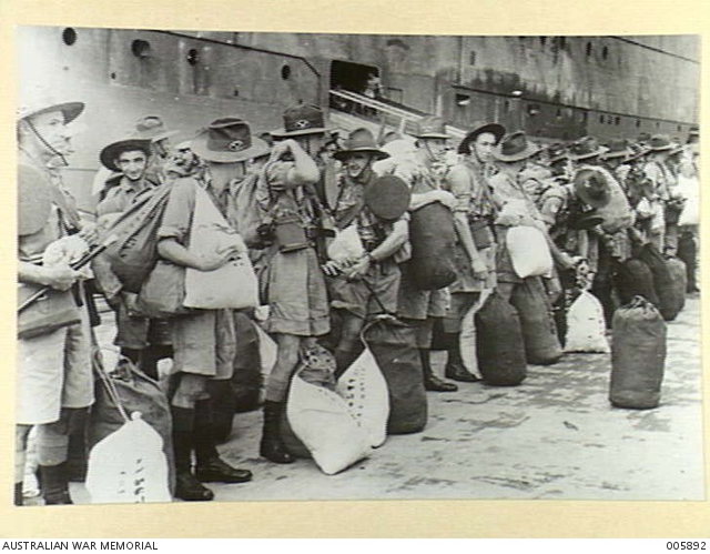 Troops of the Provost Company, 8th Division, assembled on the wharf ...