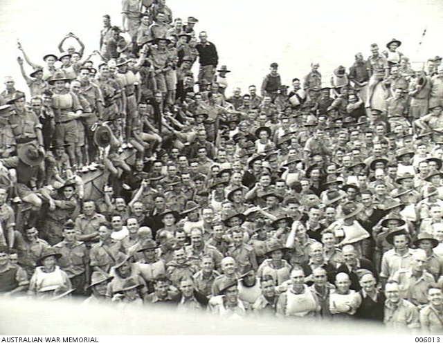 Troops of the 7th Division gathered on the deck of the troop transport ...