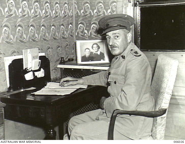 Portrait of Lieutenant Colonel R Sutherland sitting in his room ...