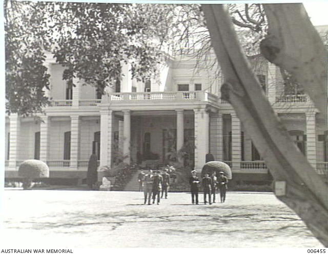 WALKING ACROSS THE GROUND OF THE BRITISH EMBASSY. (NEGATIVE BY G. SILK ...