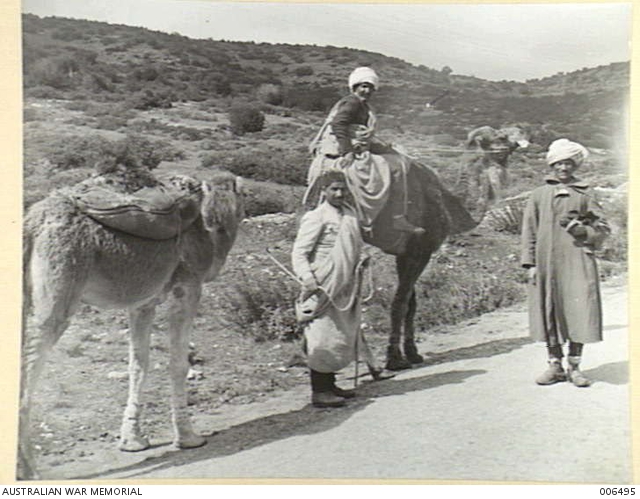 NATIVE LIBIANS ON ROAD. (NEGATIVE BY F. HURLEY). | Australian War Memorial