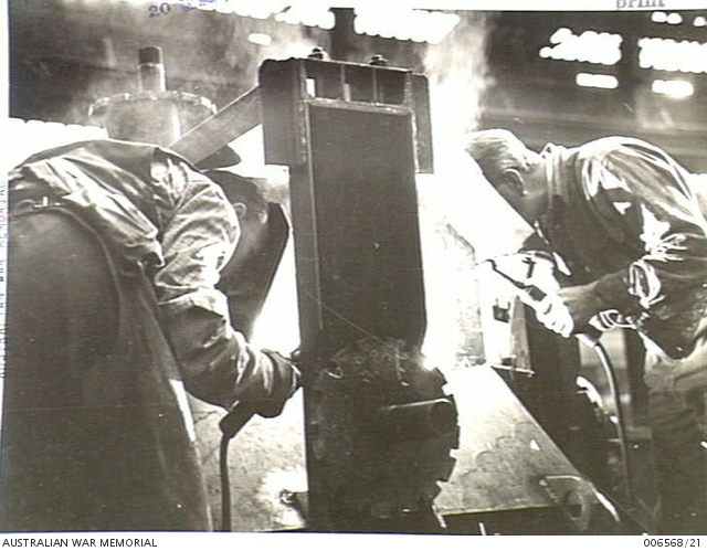 A SUB-ASSEMBLY IS MOUNTED IN A JIG, WHICH ALLOWS IT TO BE TURNED EASILY ...