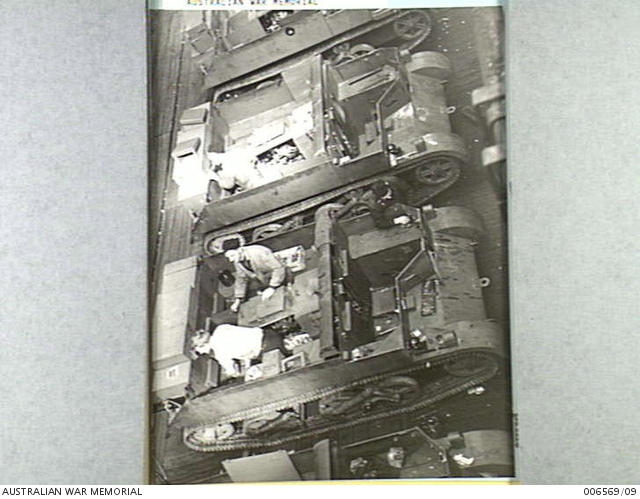 UNIVERSAL GUN CARRIERS ON THE ASSEMBLY LINE IN A VICTORIAN WORKSHOP. | Australian War Memorial