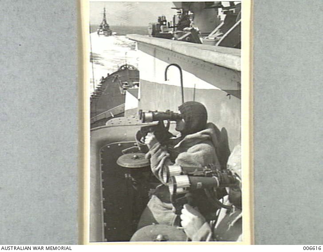 PORT LOOKOUTS OF HMAS PERTH ON DUTY AS THE SHIP STEAMS ON PATROL BEHIND ...