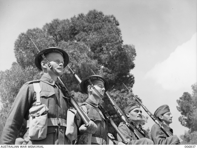 AUSTRALIAN AND GREEK SOLDIERS MOUNTING GUARD OVER THE CAMP AREA AT ...