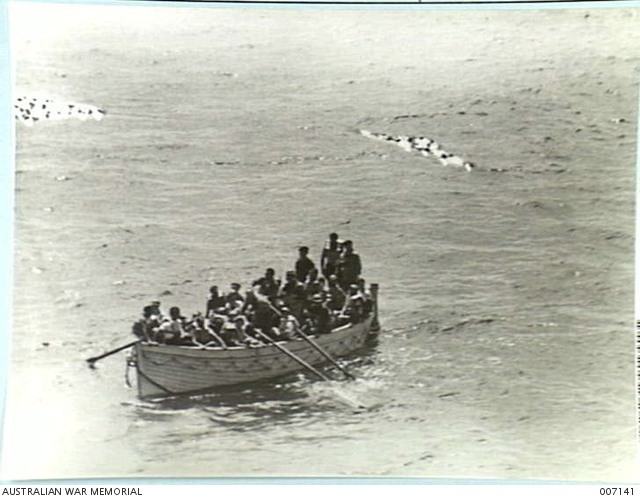 "RAMB 1". CRAMMED WITH MEMBERS OF THE RAIDER'S CREW, A LIFE BOAT COMES ...