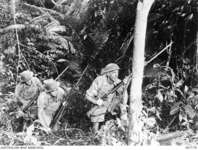 A.I.F. IN MALAYA. MEN OF THE A.I.F. ADVANCING THROUGH DENSE JUNGLE ...